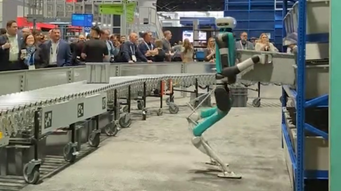 A robot falls to the floor after a long working day accommodating boxes ...